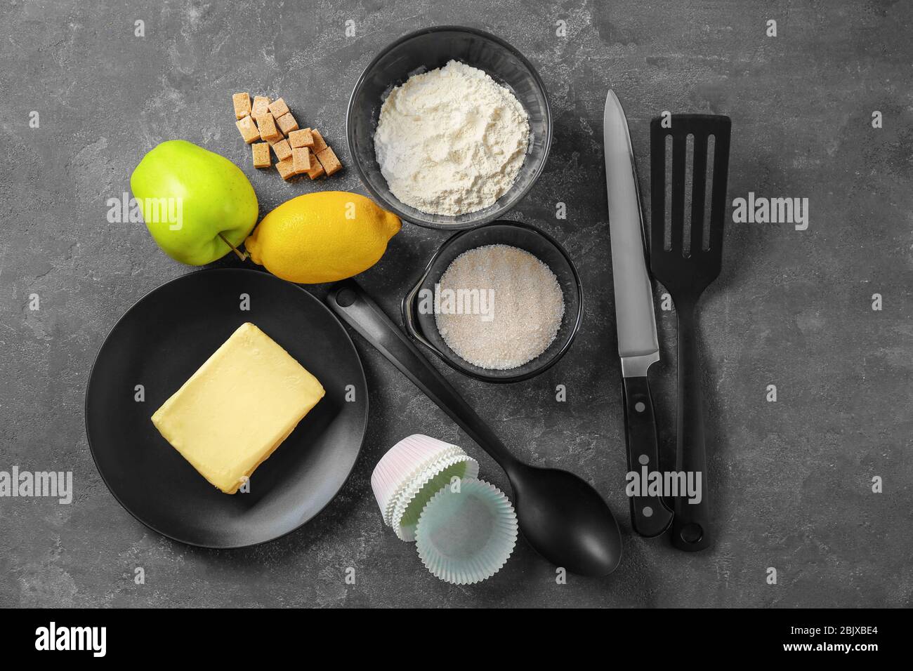 Set of kitchen utensils with products on grey background. Cooking ...