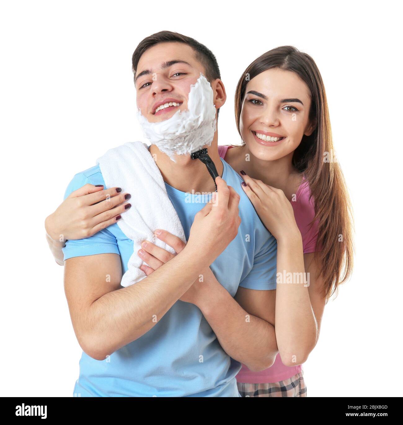 Young man shaving and his girlfriend on white background Stock Photo ...