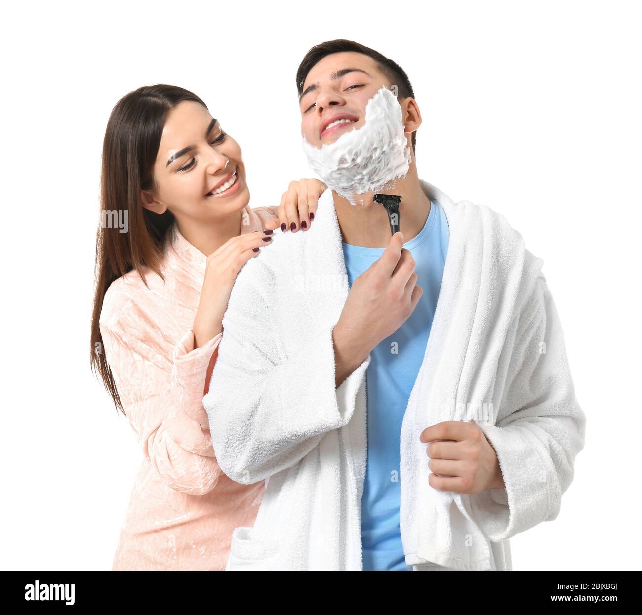 Young man shaving and his girlfriend on white background Stock Photo ...