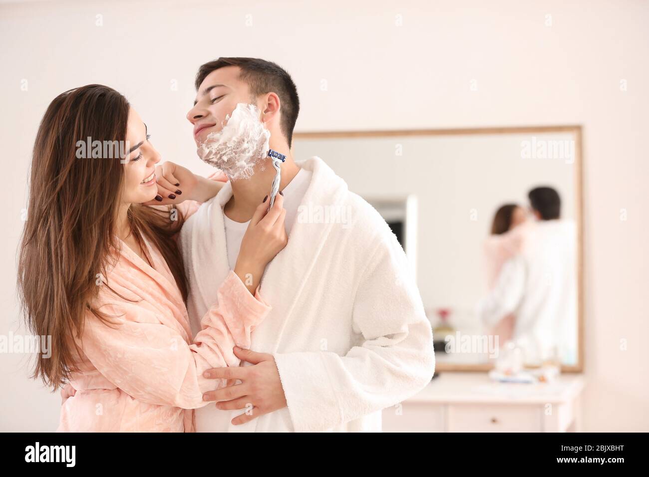 Woman shaving boyfriend face hi-res stock photography and images - Alamy