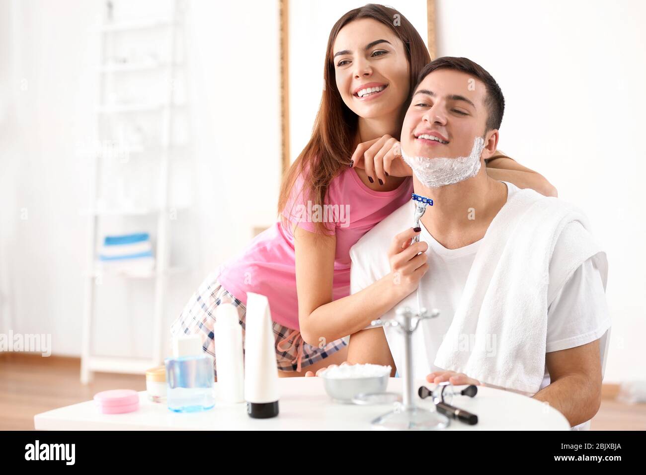 Woman shaving boyfriend face hi-res stock photography and images - Alamy