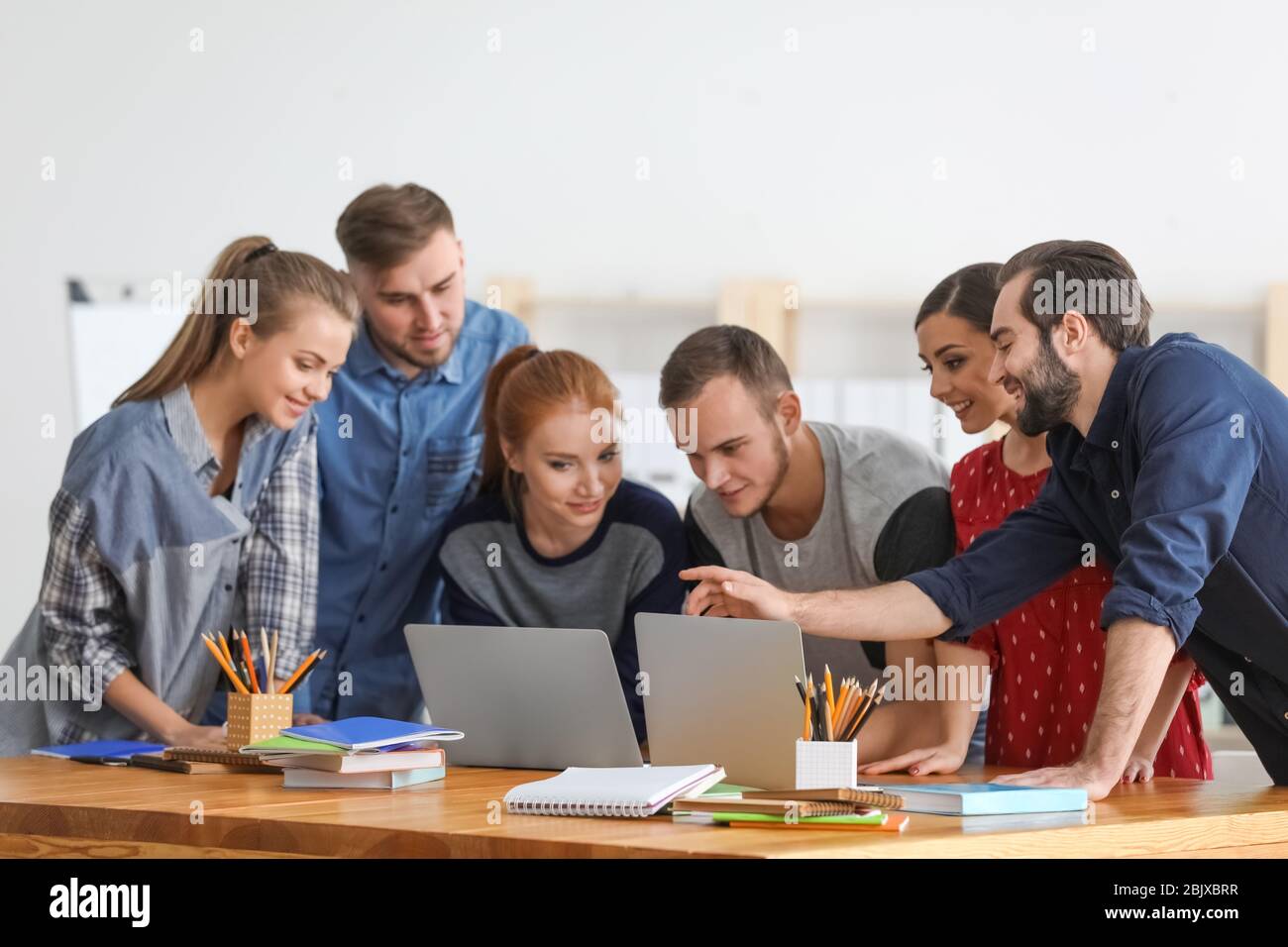 Male students doing research books hi-res stock photography and images ...