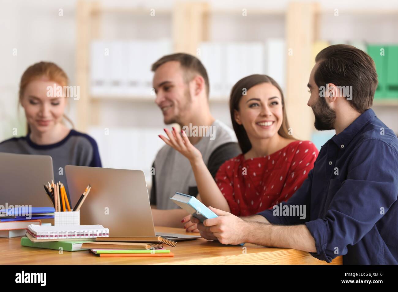 Male students doing research books hi-res stock photography and images ...