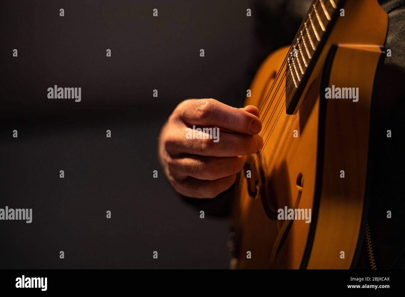 close up performer plays classical mandolin on stage Stock Photo - Alamy