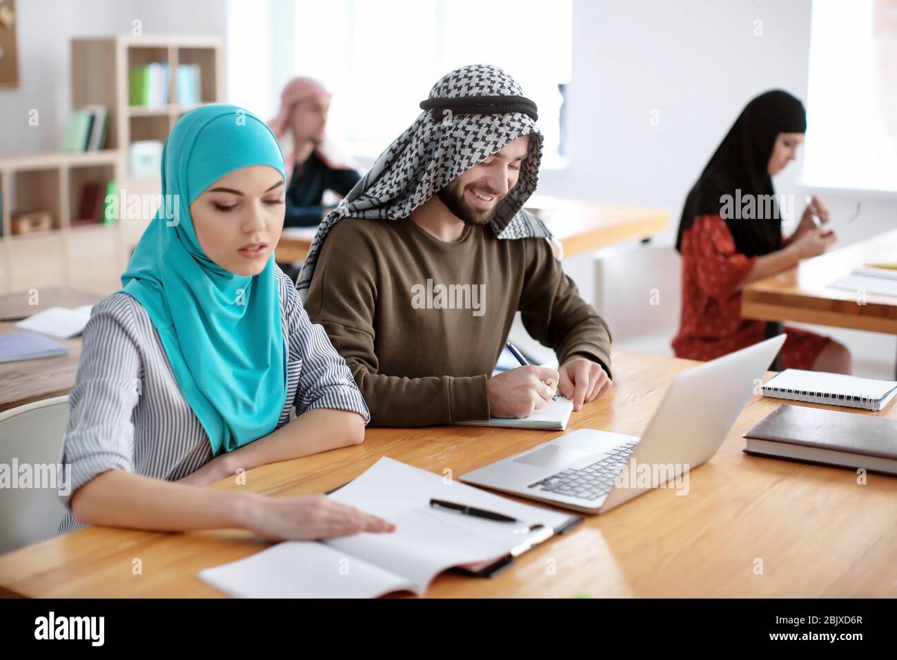 Muslim students wearing traditional clothes in classroom Stock Photo ...