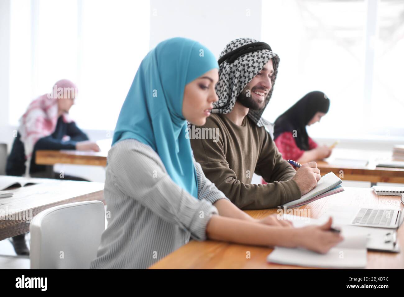 Muslim students wearing traditional clothes in classroom Stock Photo ...