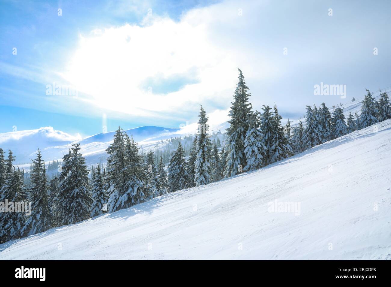 Ski slope at snowy resort on winter day Stock Photo - Alamy