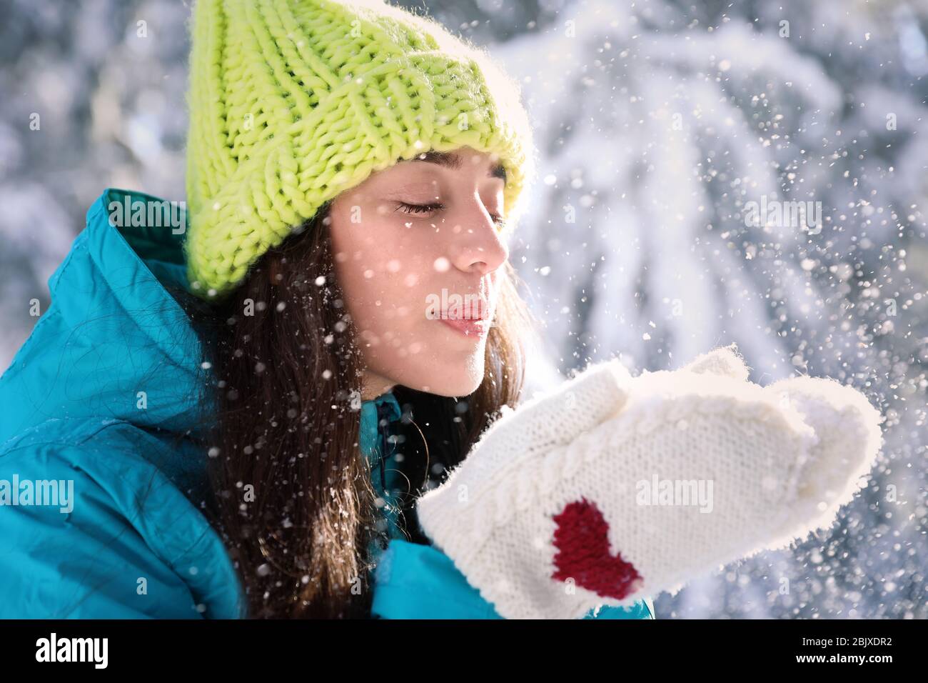 Beautiful caucasian woman blowing snow hi-res stock photography and images - Alamy