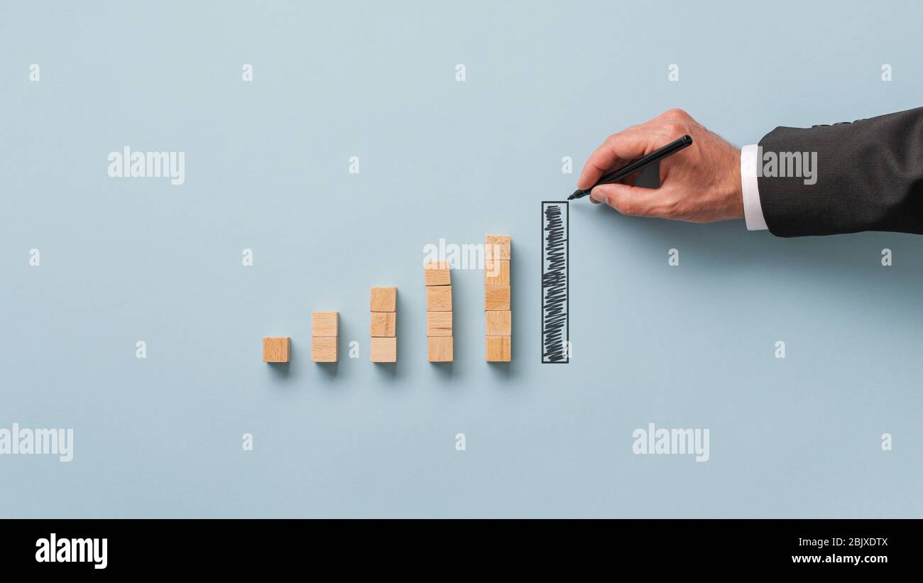 Hand of a businessman drawing financial graph bar in a conceptual image ...