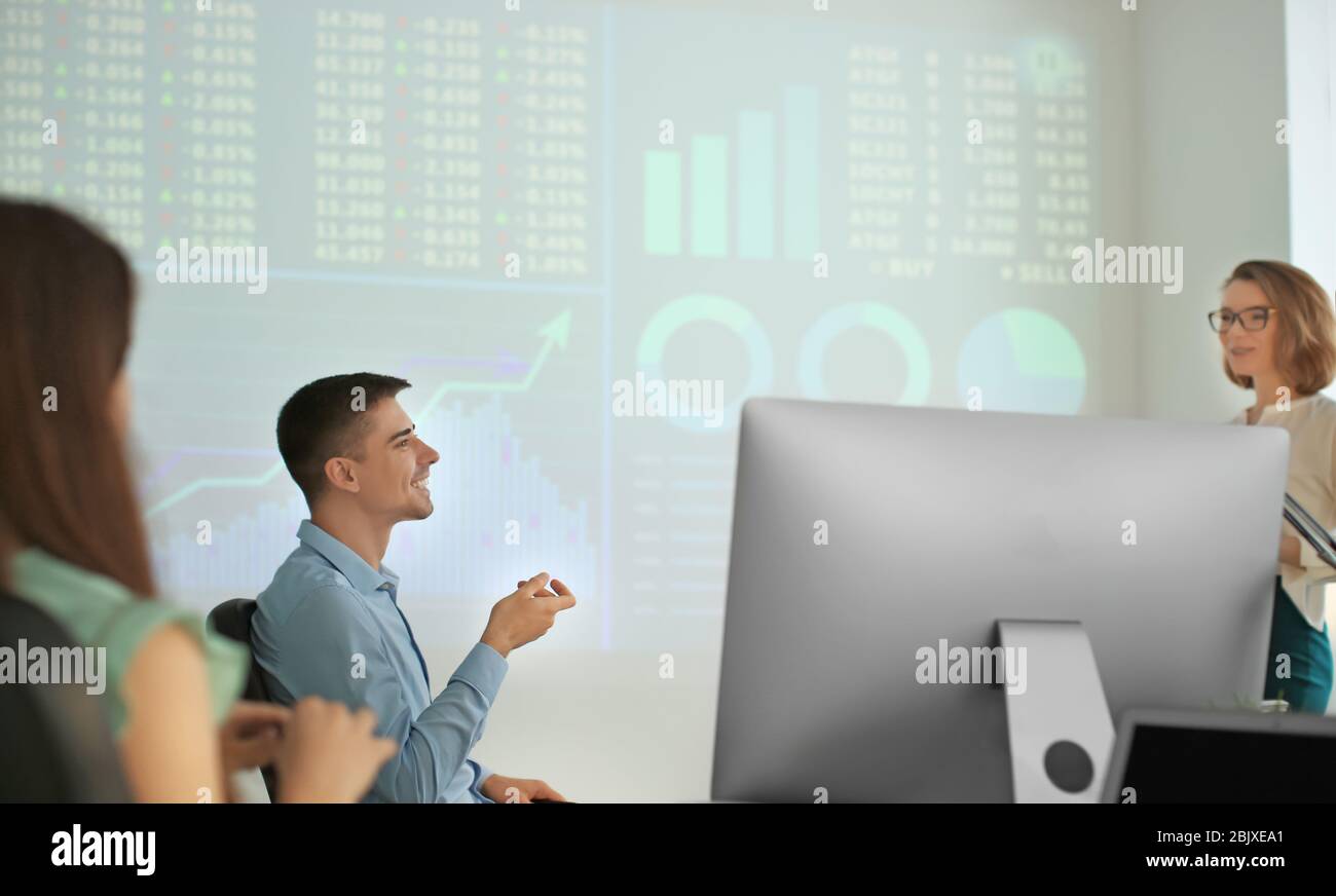 Office employees watching presentation during meeting. Forex concept ...