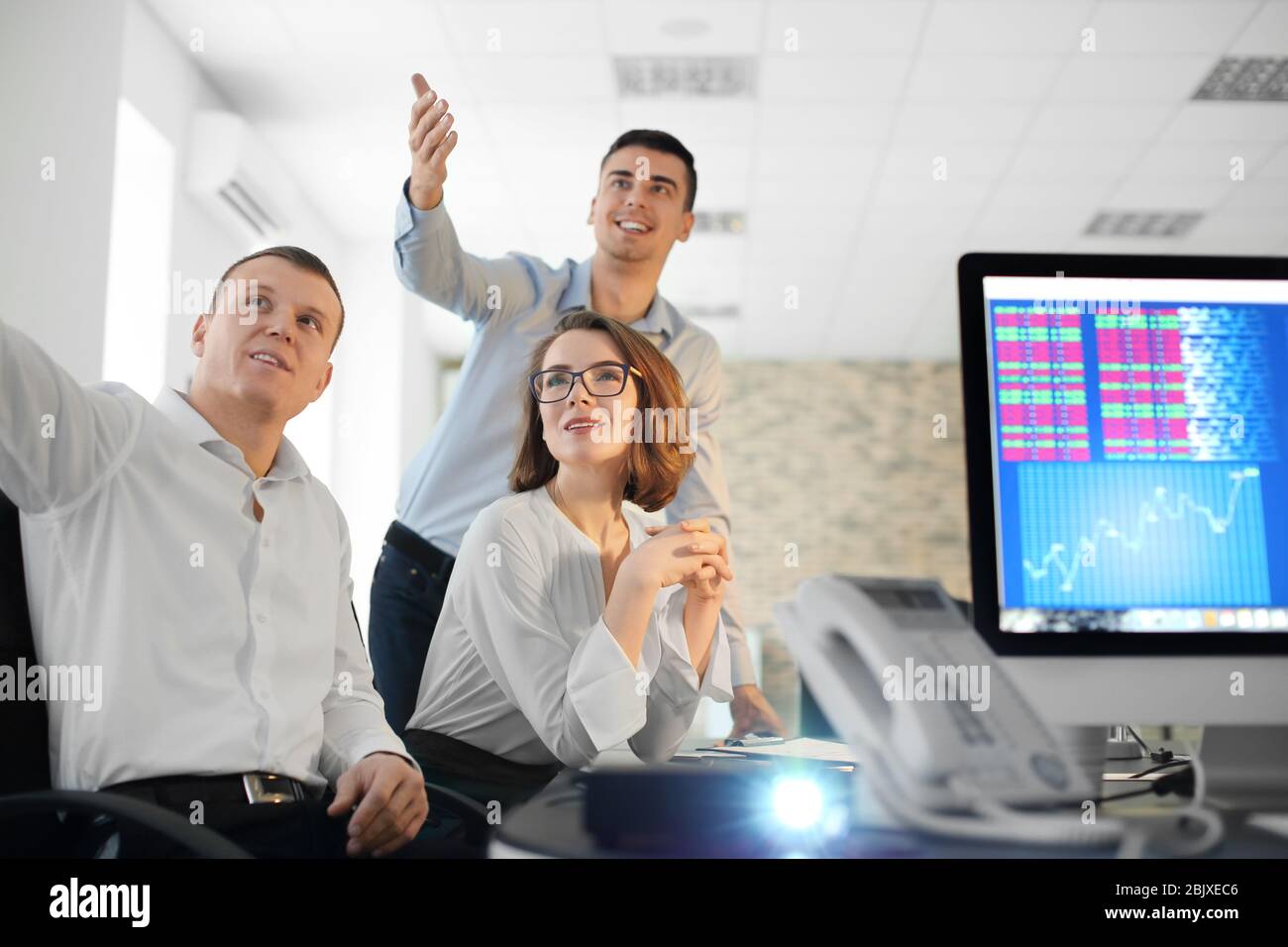 Office employees watching presentation during meeting. Forex concept ...