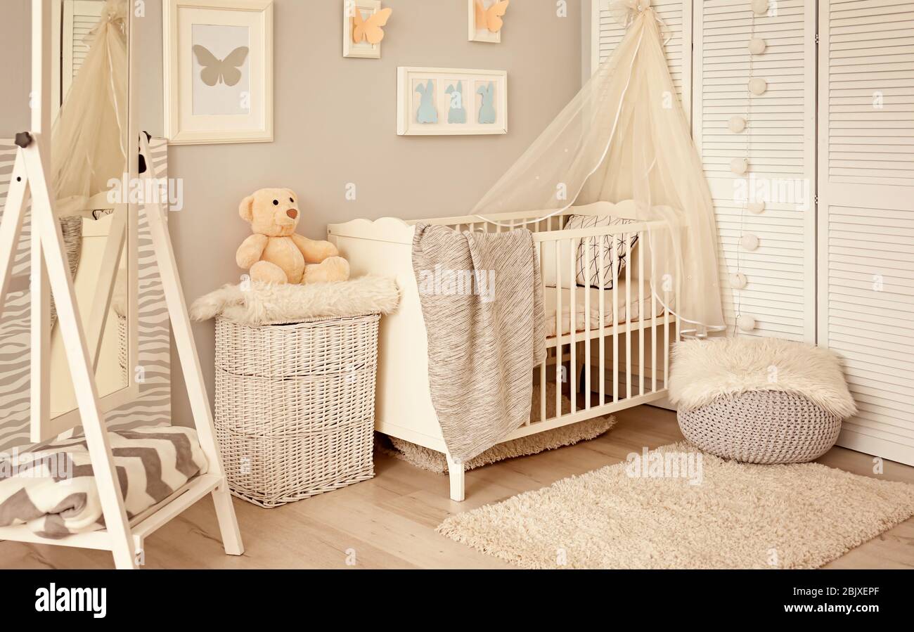 Baby room interior with crib. House design Stock Photo - Alamy