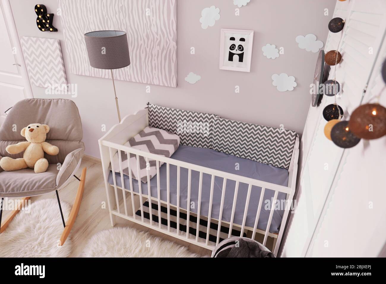 Baby room interior with crib. House design Stock Photo - Alamy