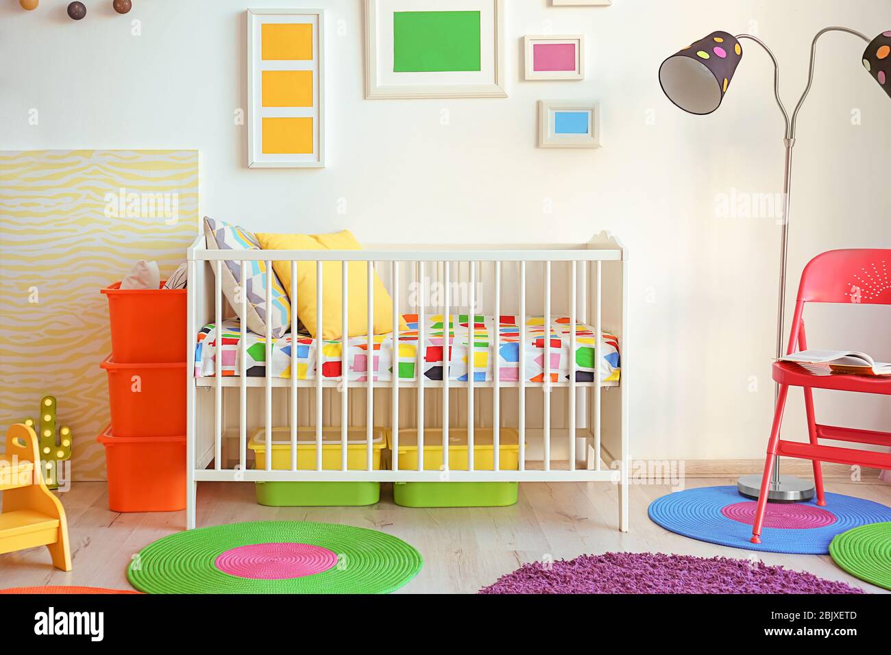 Baby room interior with crib. House design Stock Photo - Alamy