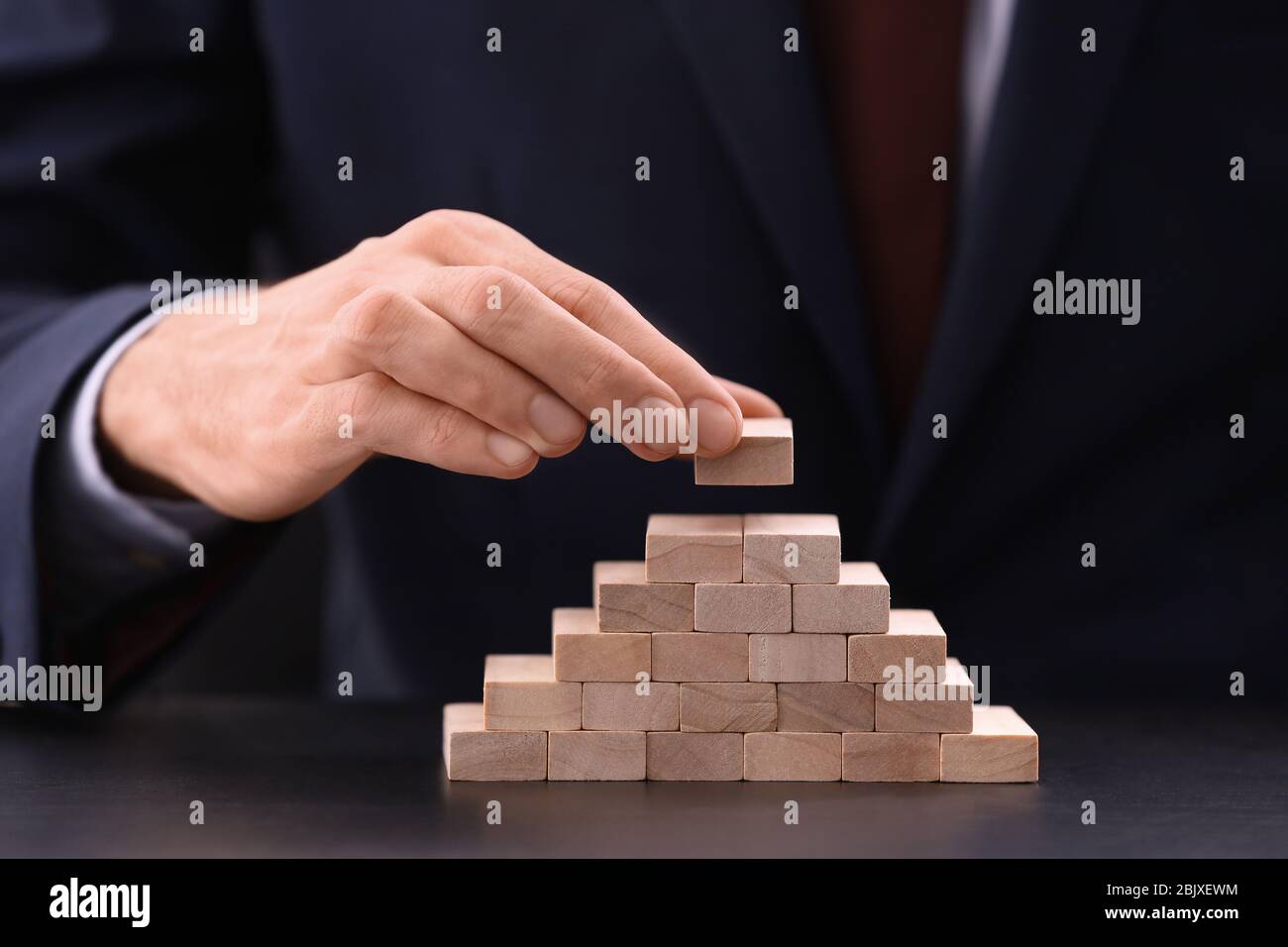 Hand building pyramid hi-res stock photography and images - Alamy