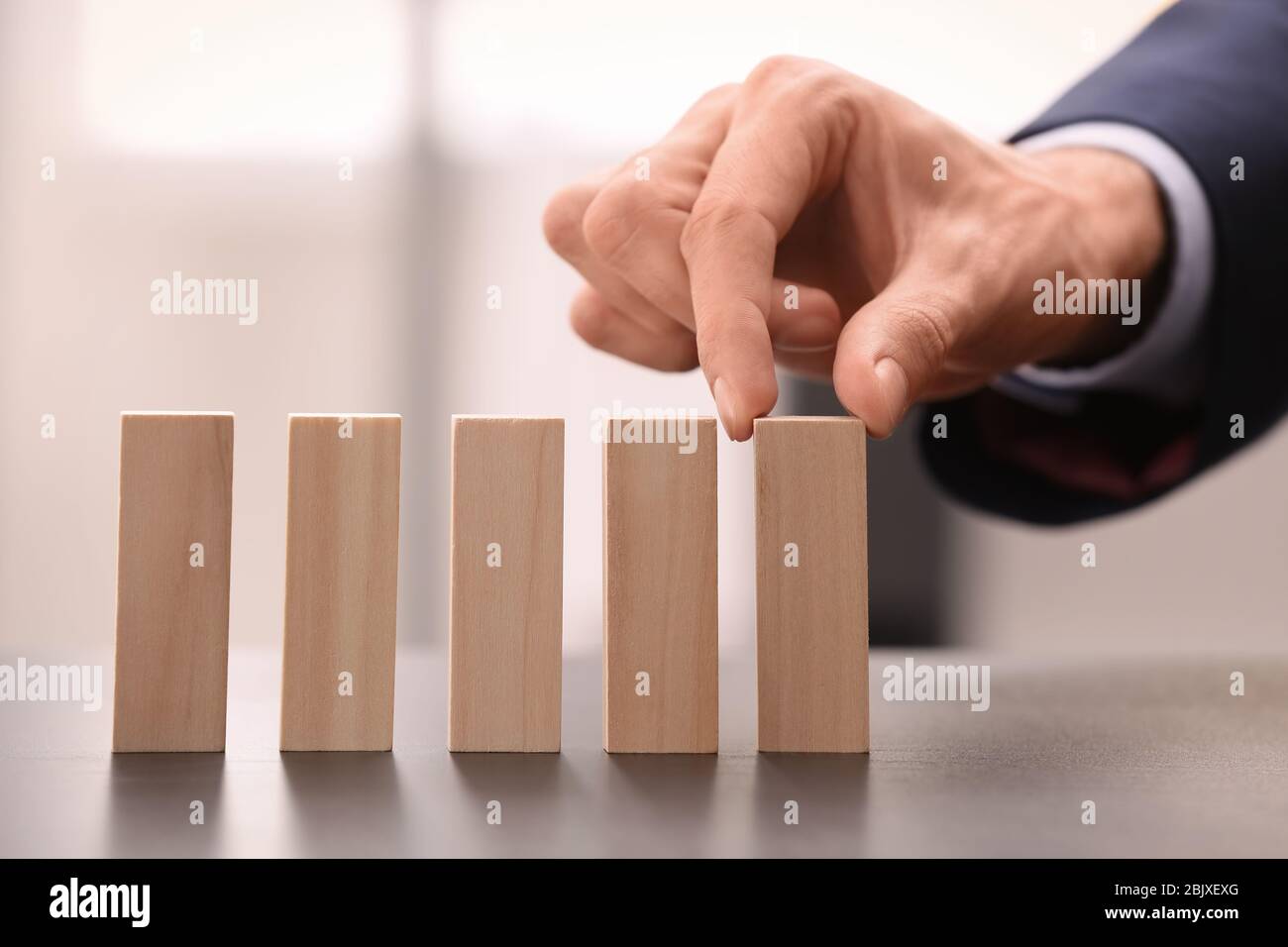 Man putting wooden blocks hi-res stock photography and images - Alamy