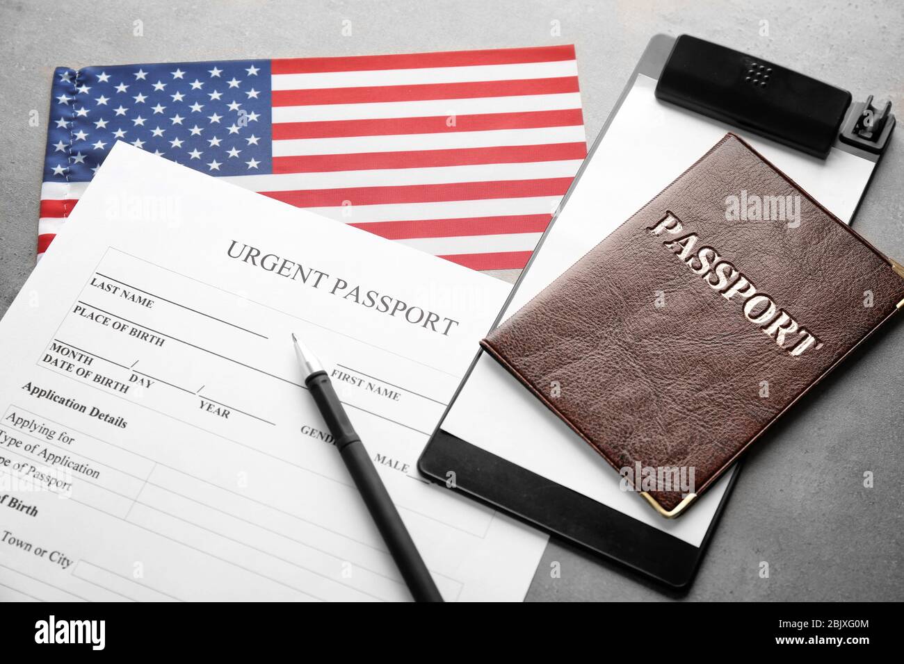 Passport, American flag and application form on table. Immigration to ...
