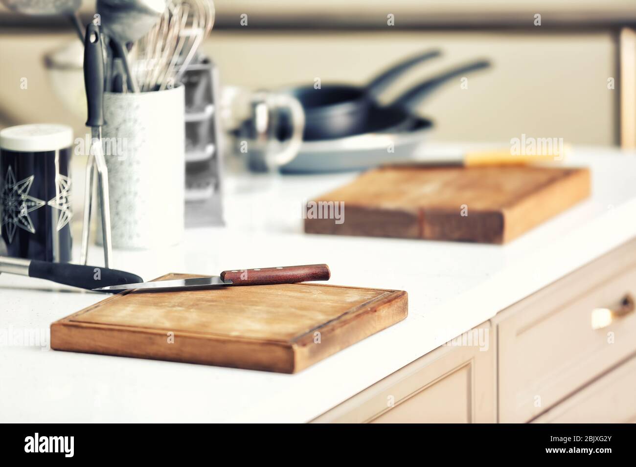 Cutting boards and kitchenware prepared for cooking classes on table ...