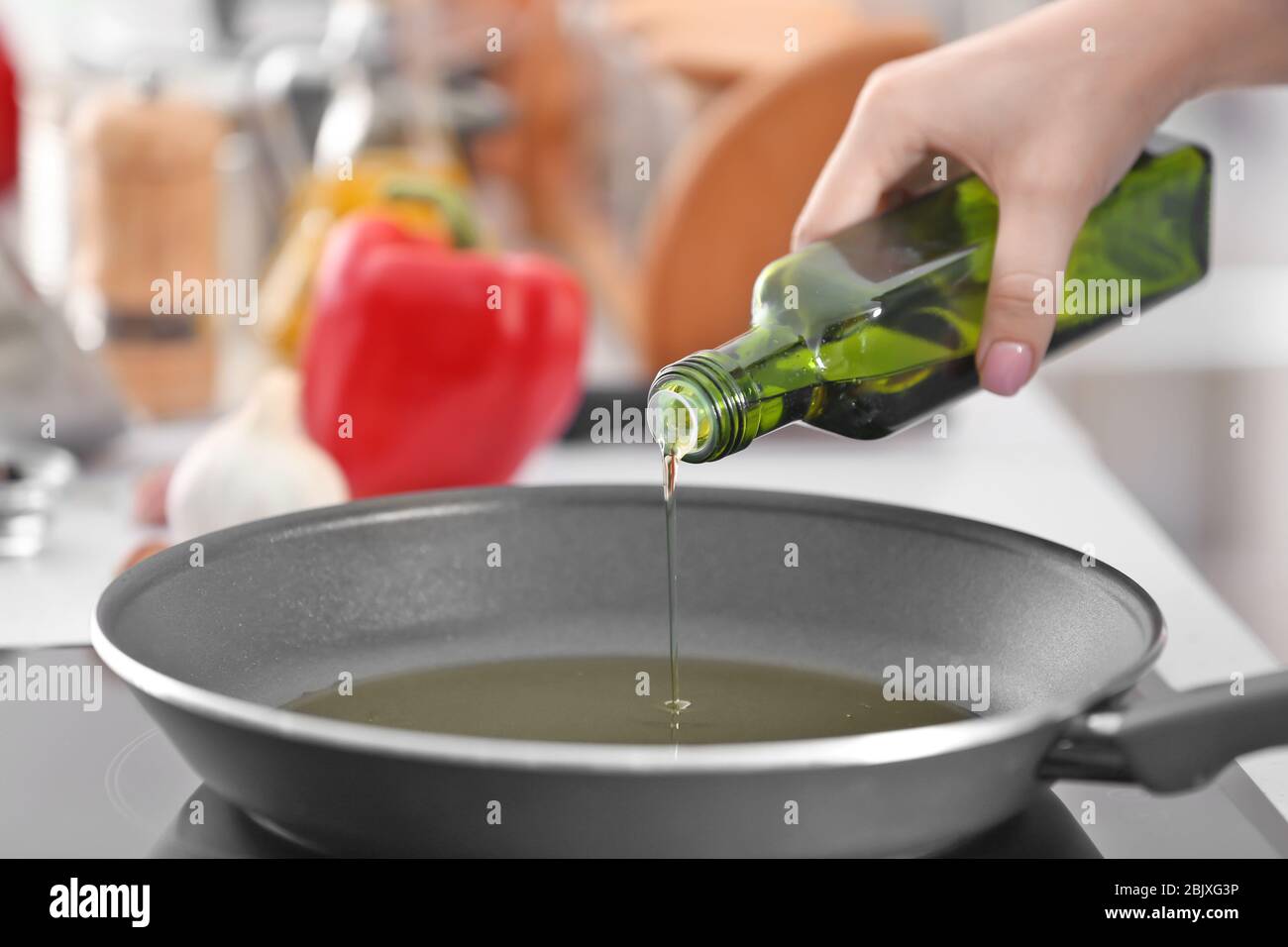 Closeup person pouring olive hi-res stock photography and images - Alamy
