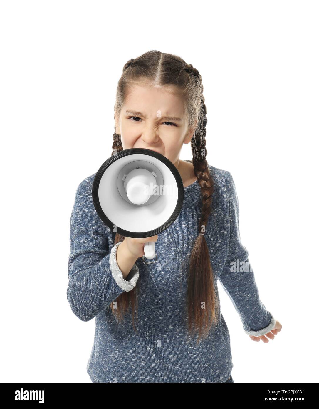 Angry little girl shouting into megaphone on white background Stock ...