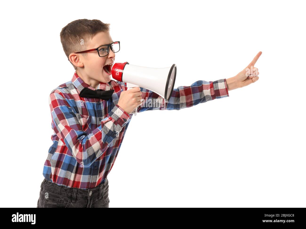 Emotional little boy shouting into megaphone on white background Stock ...