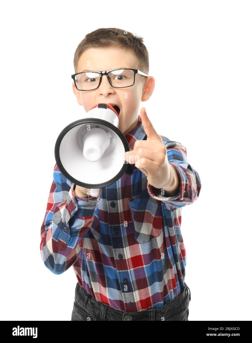 Emotional little boy shouting into megaphone on white background Stock ...