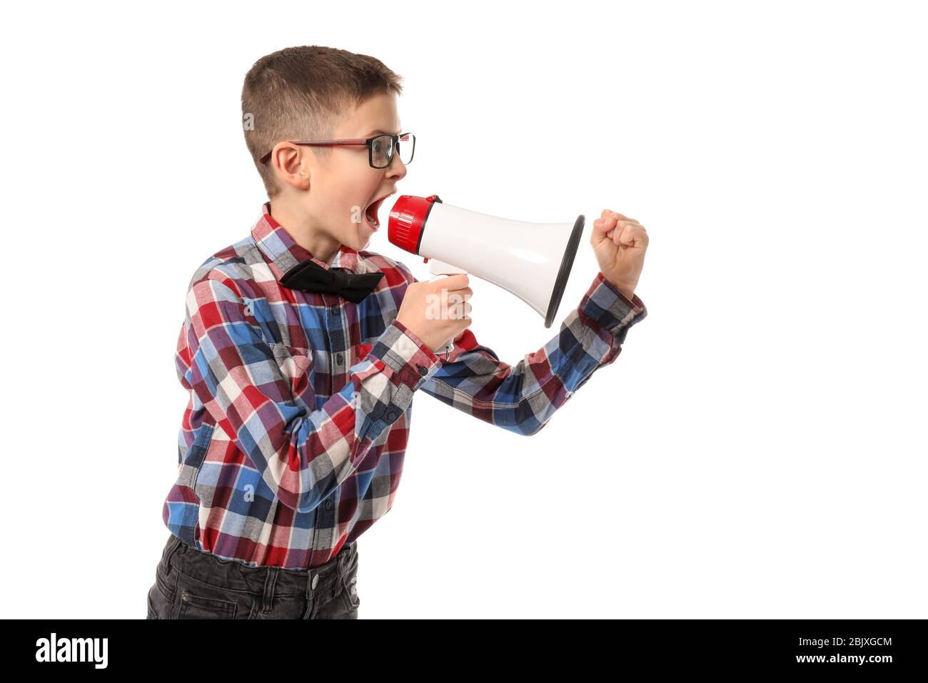 Emotional little boy shouting into megaphone on white background Stock ...