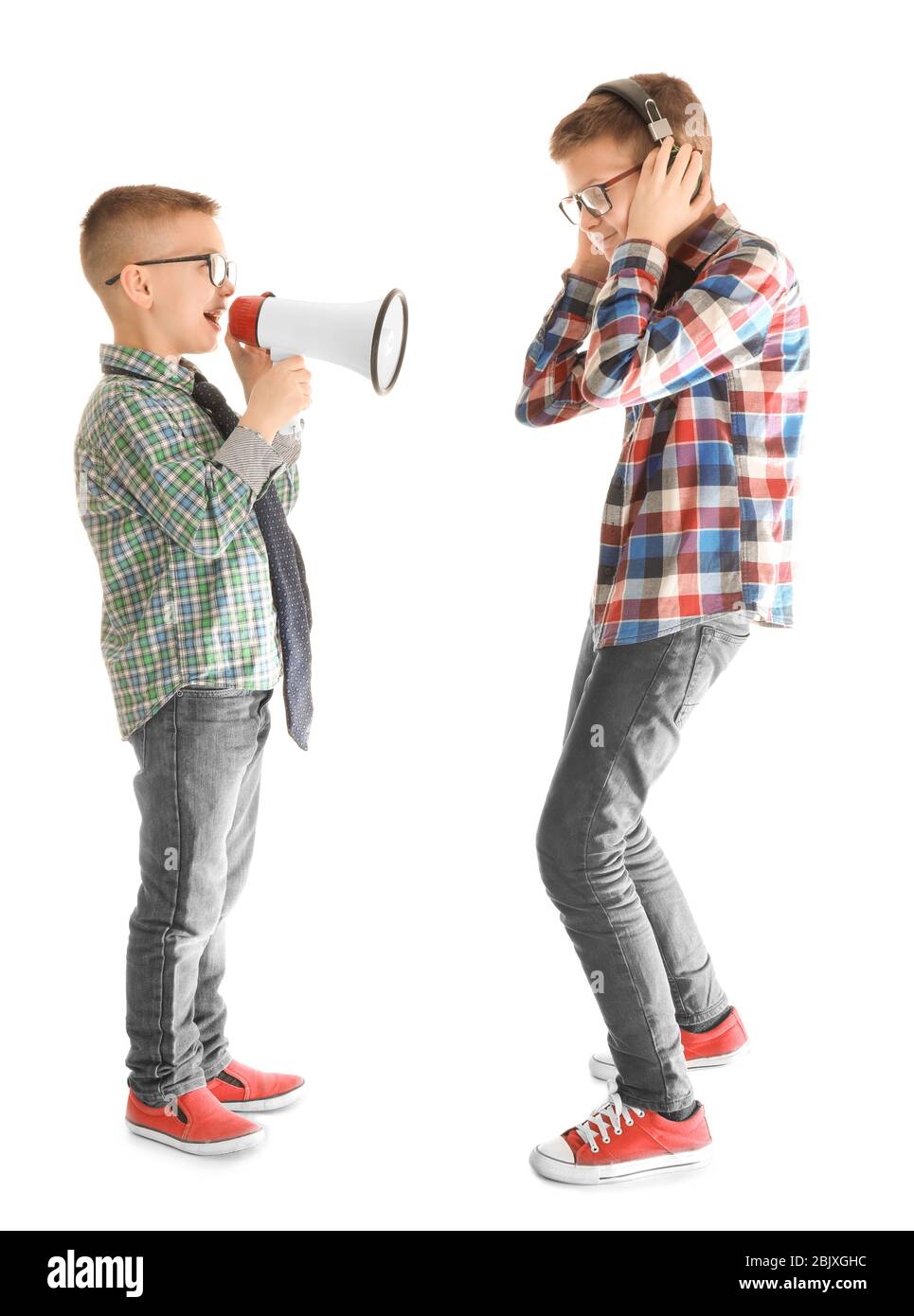 Cute little boy ignoring his friend with megaphone, on white background ...