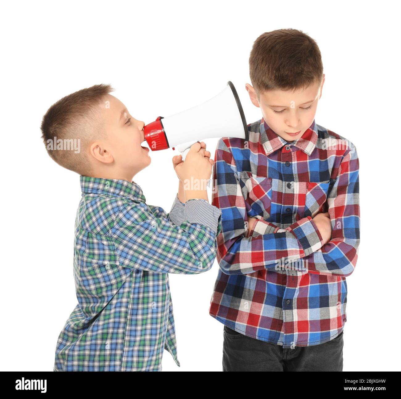 Little boy with megaphone shouting at another one, on white background ...