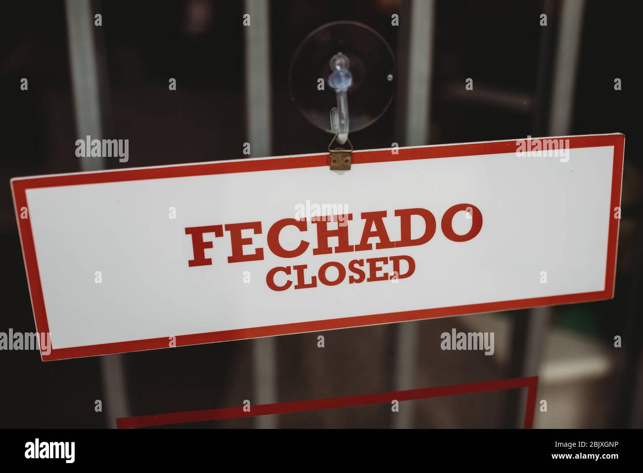 Closed sign on shop window in portuguese Stock Photo - Alamy