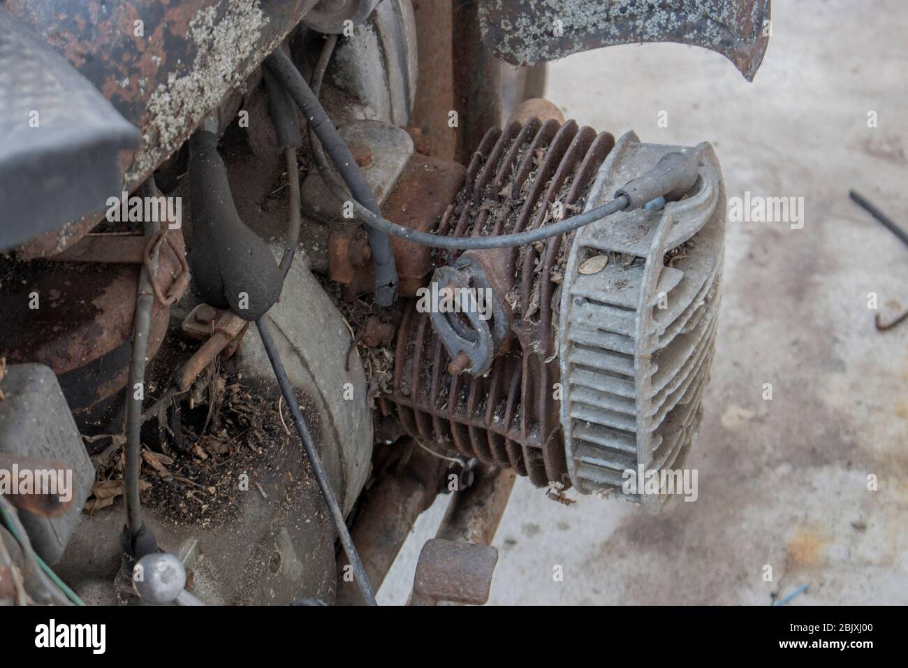 The head of an old retro bike with an opposing engine, rusty metal on a ...