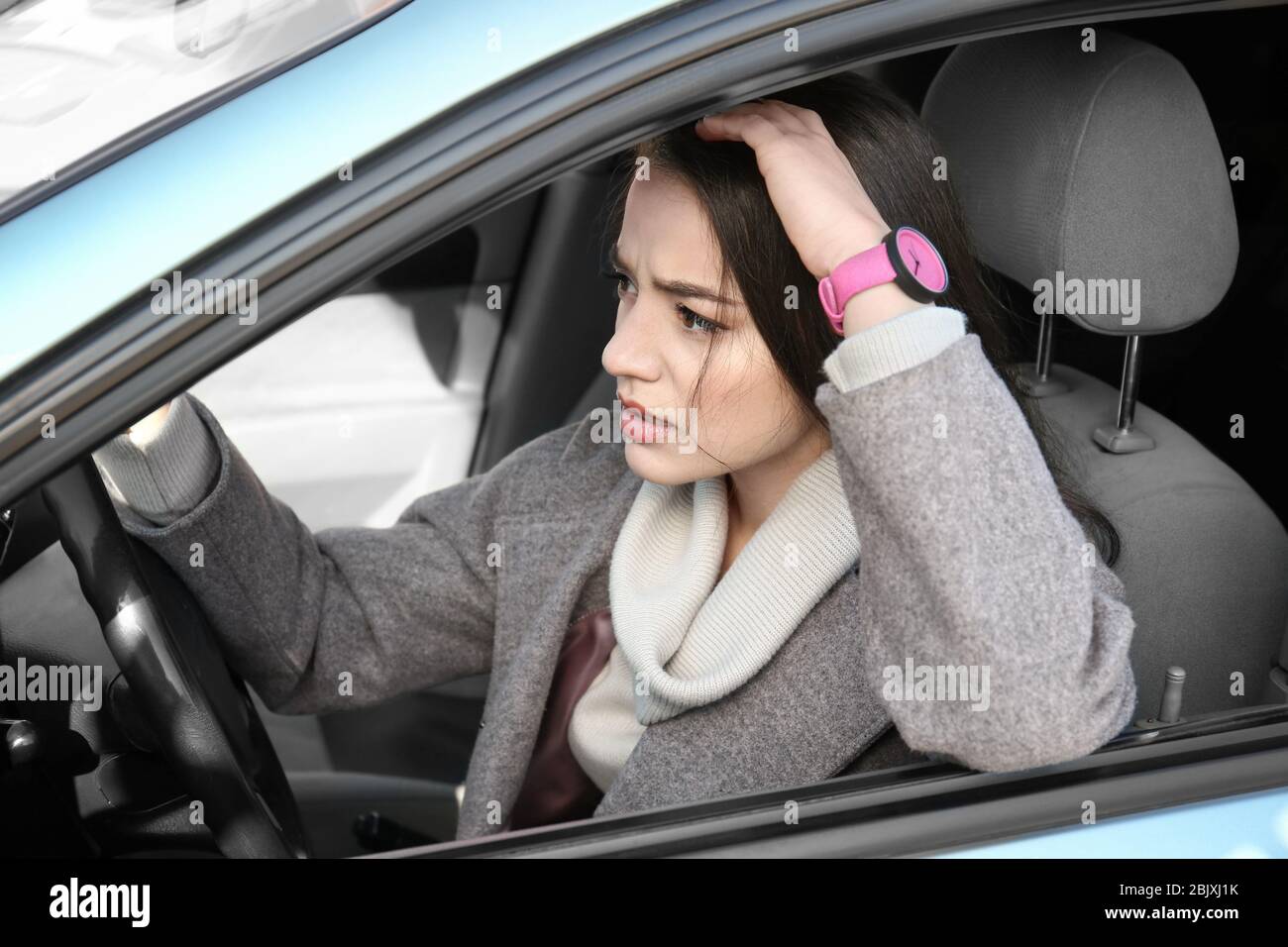 Young woman in car during traffic jam Stock Photo - Alamy