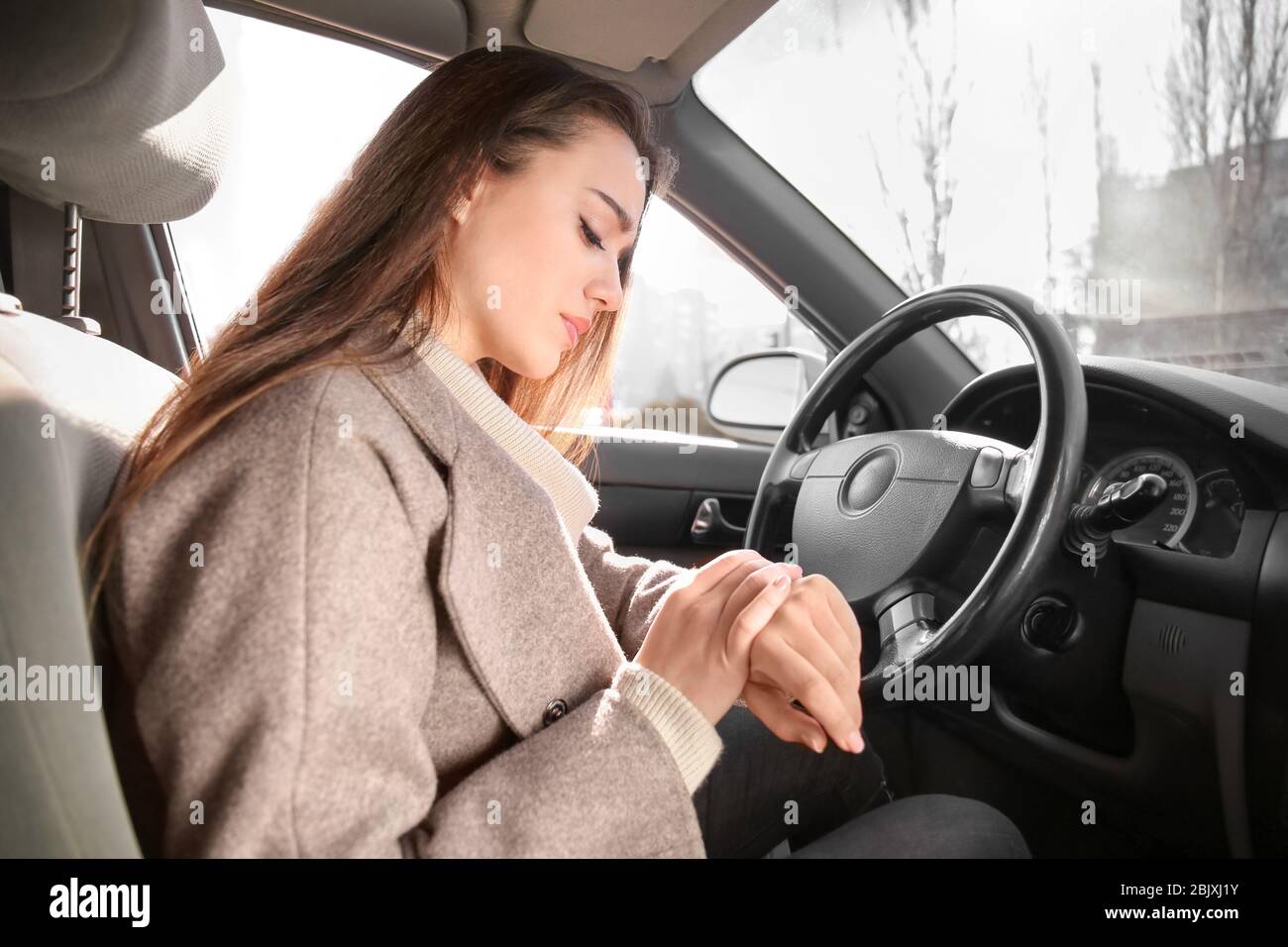 Young woman in car during traffic jam Stock Photo - Alamy