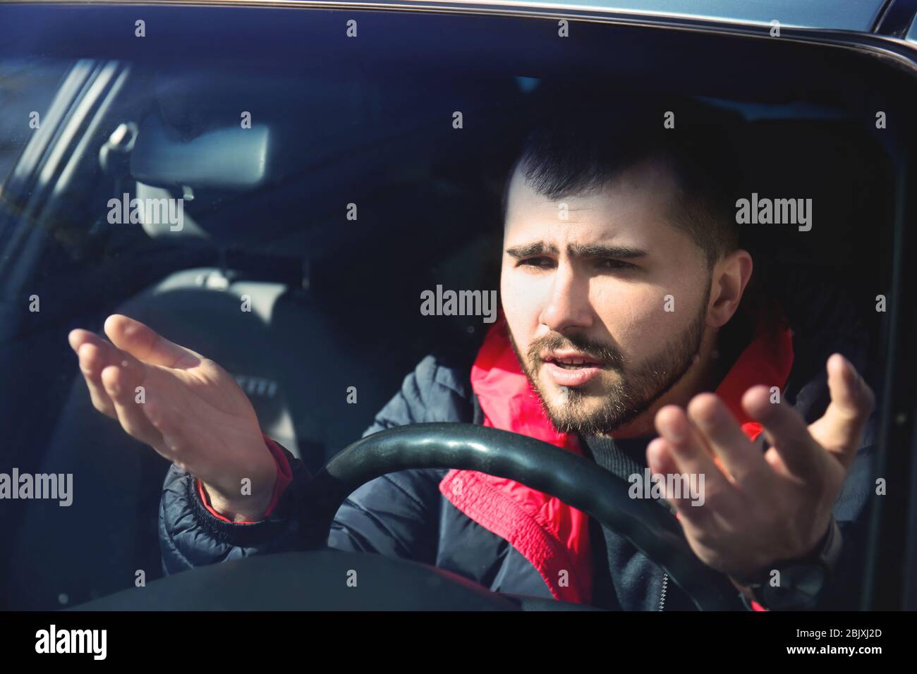 An irritated young man driving hi-res stock photography and images - Alamy