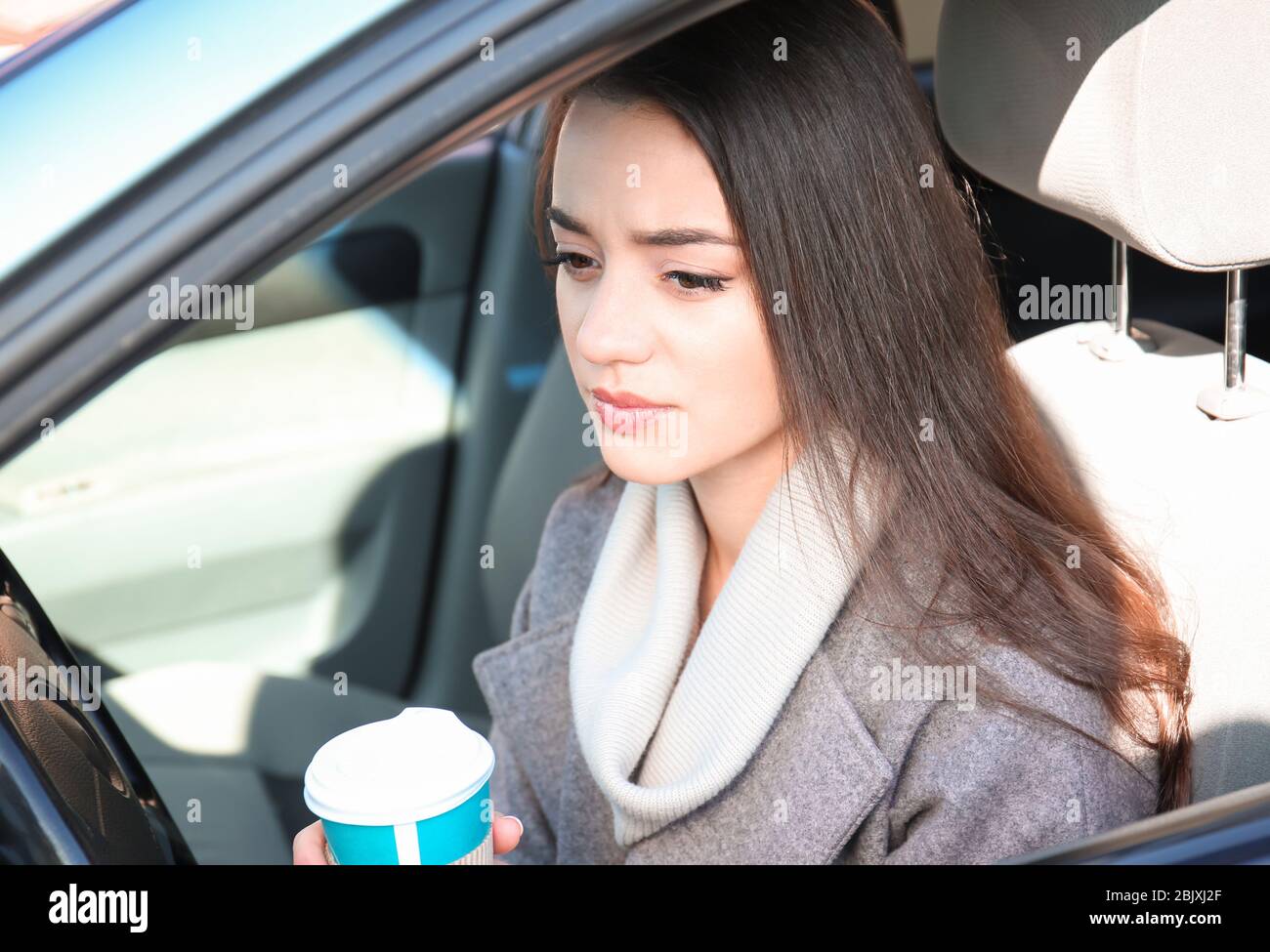 Young woman in car during traffic jam Stock Photo - Alamy
