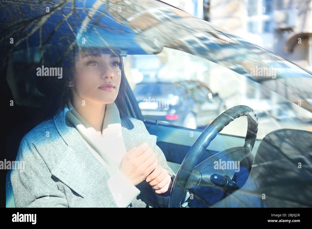 Young woman in car during traffic jam Stock Photo - Alamy