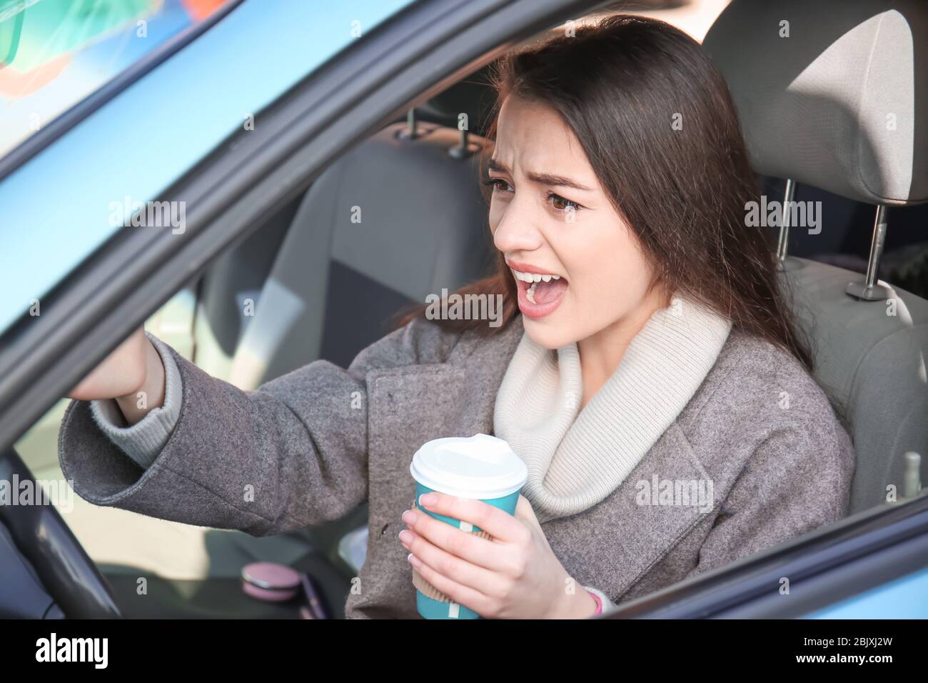 Young woman in car during traffic jam Stock Photo - Alamy
