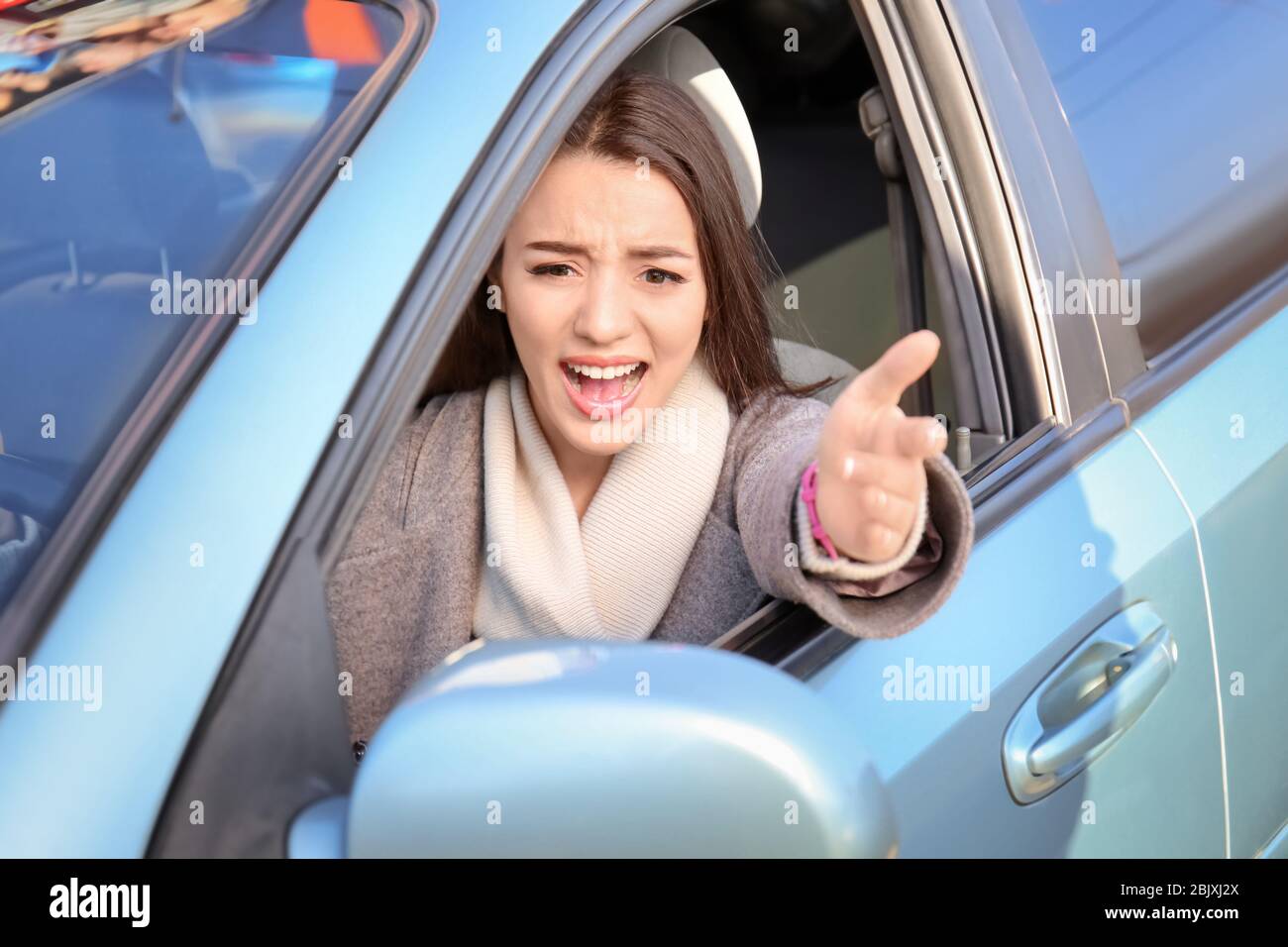 Young woman in car during traffic jam Stock Photo - Alamy