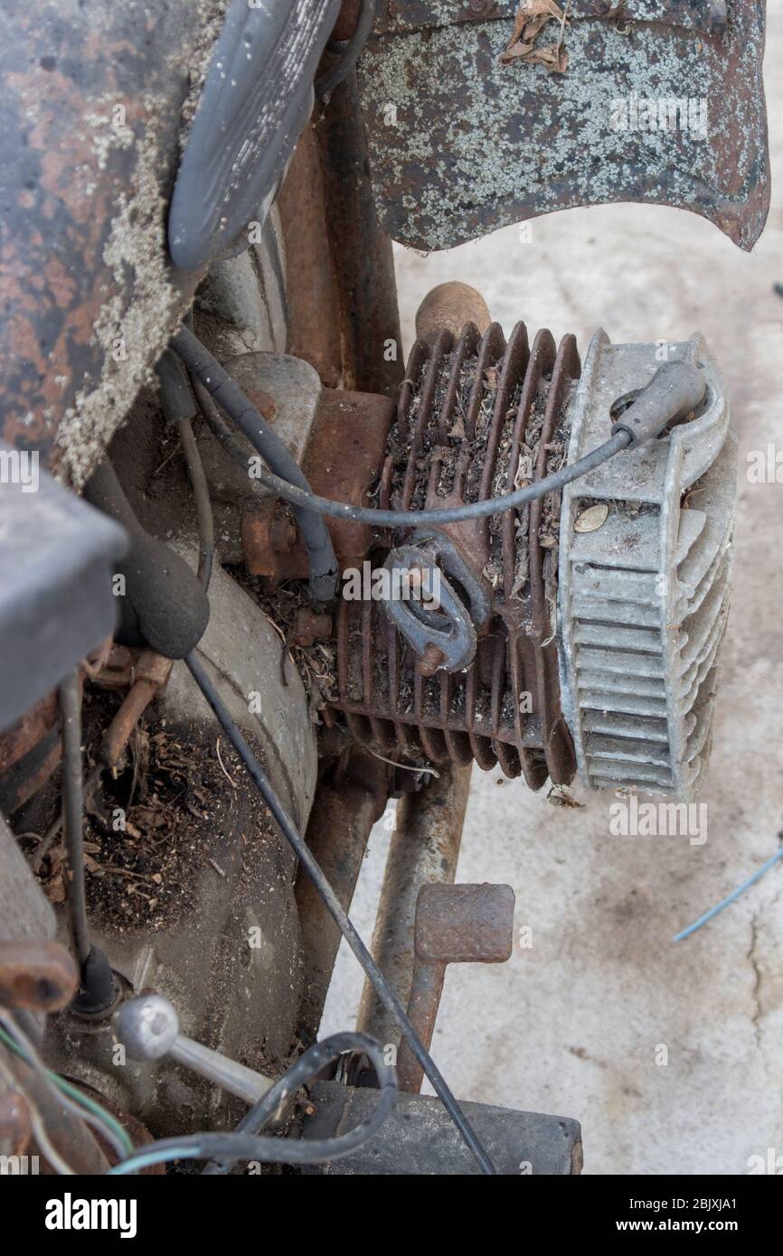 The head of an old retro bike with an opposing engine, rusty metal on a ...