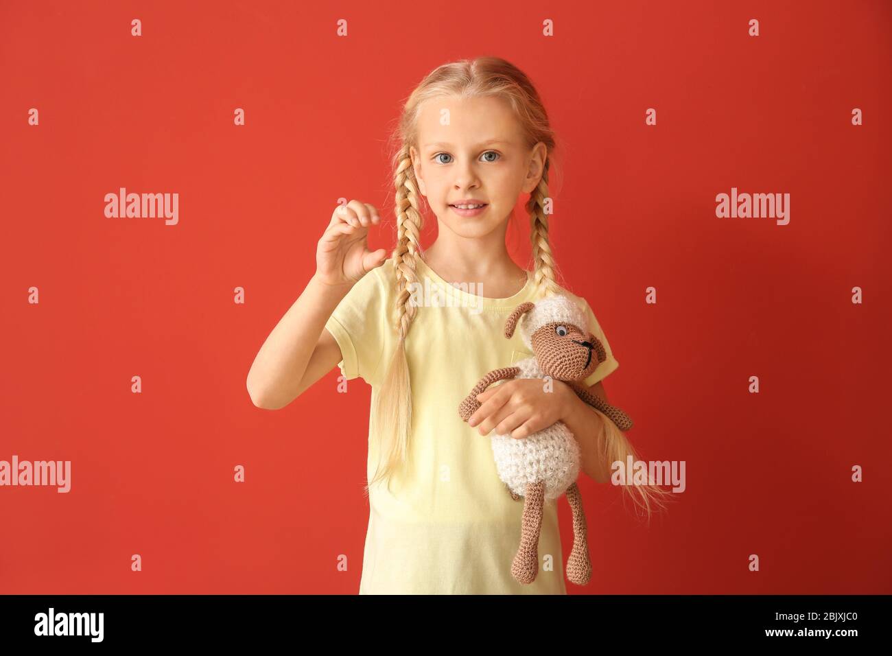 Little deaf mute girl using sign language on color background Stock ...