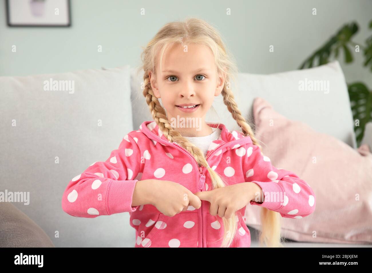 Deaf kid girl showing sign language hi-res stock photography and images ...