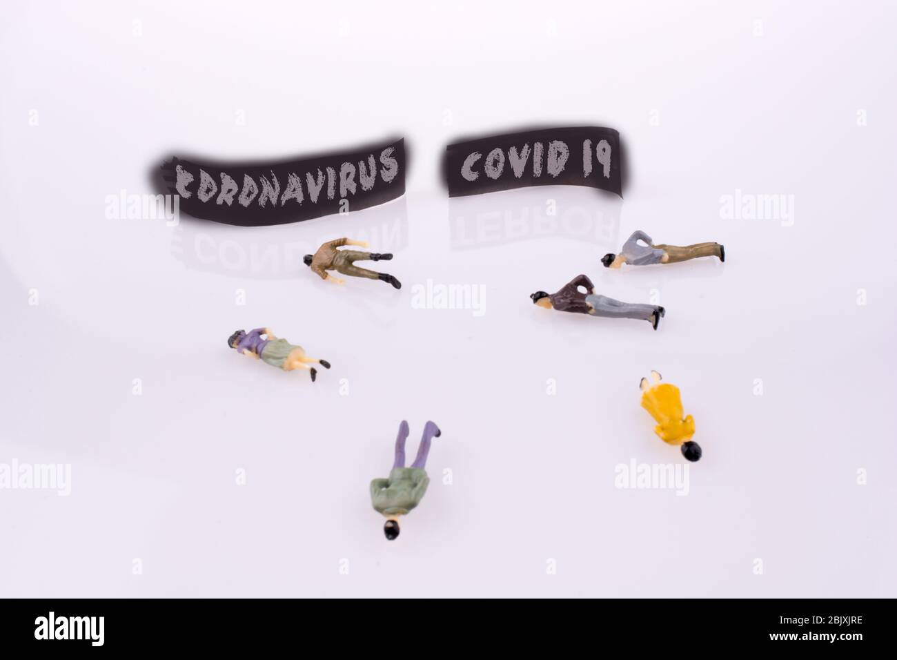 Human Figures near torn Newspaper Title Stock Photo - Alamy