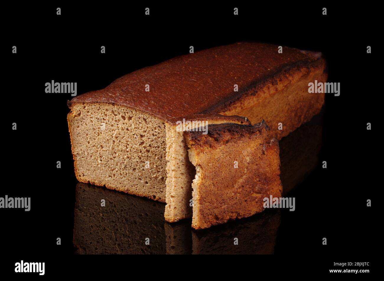 Traditional lithuanian rye bread (dark bread) loaf isolated on the black background Stock Photo ...