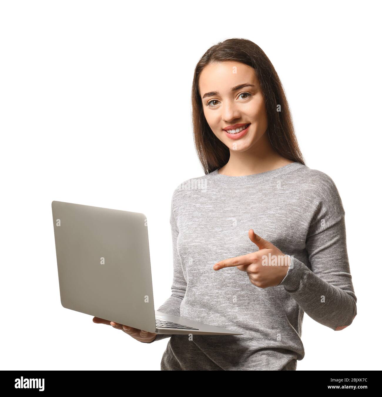 Young female programmer with laptop on white background Stock Photo - Alamy