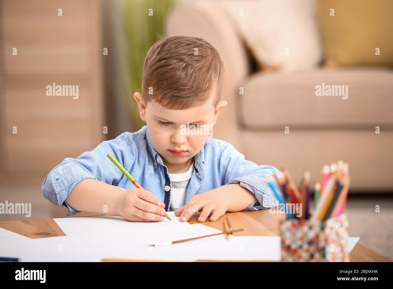 Cute little boy drawing at home Stock Photo - Alamy