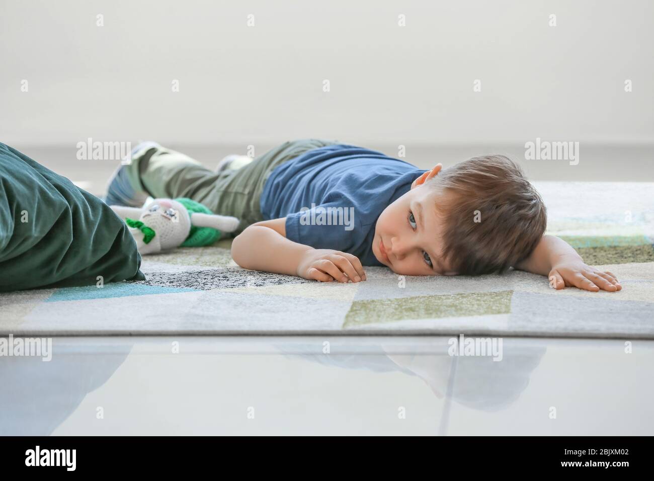 Little boy with autistic disorder at home Stock Photo - Alamy