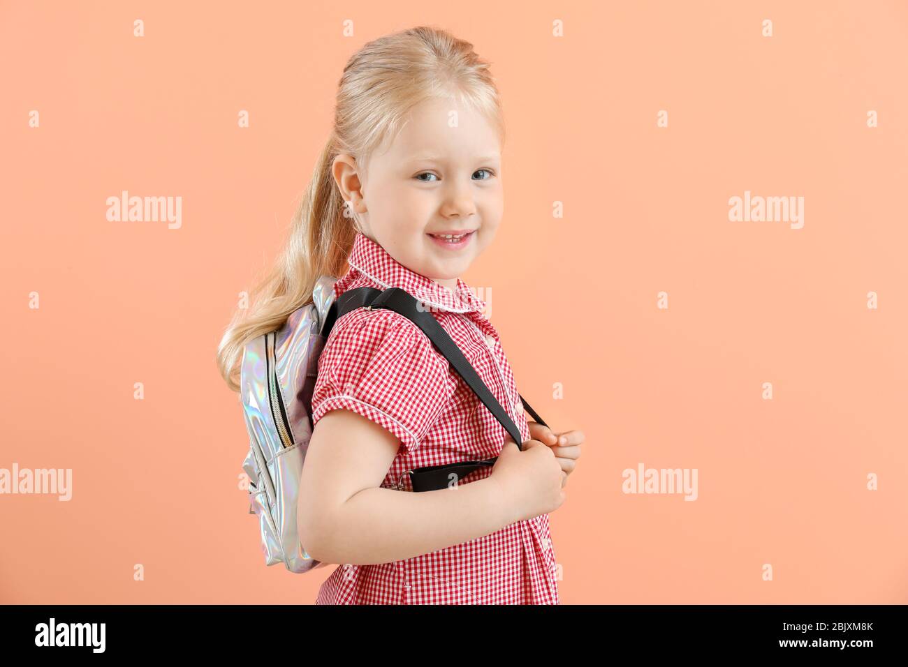 Portrait of adorable little girl on color background Stock Photo - Alamy