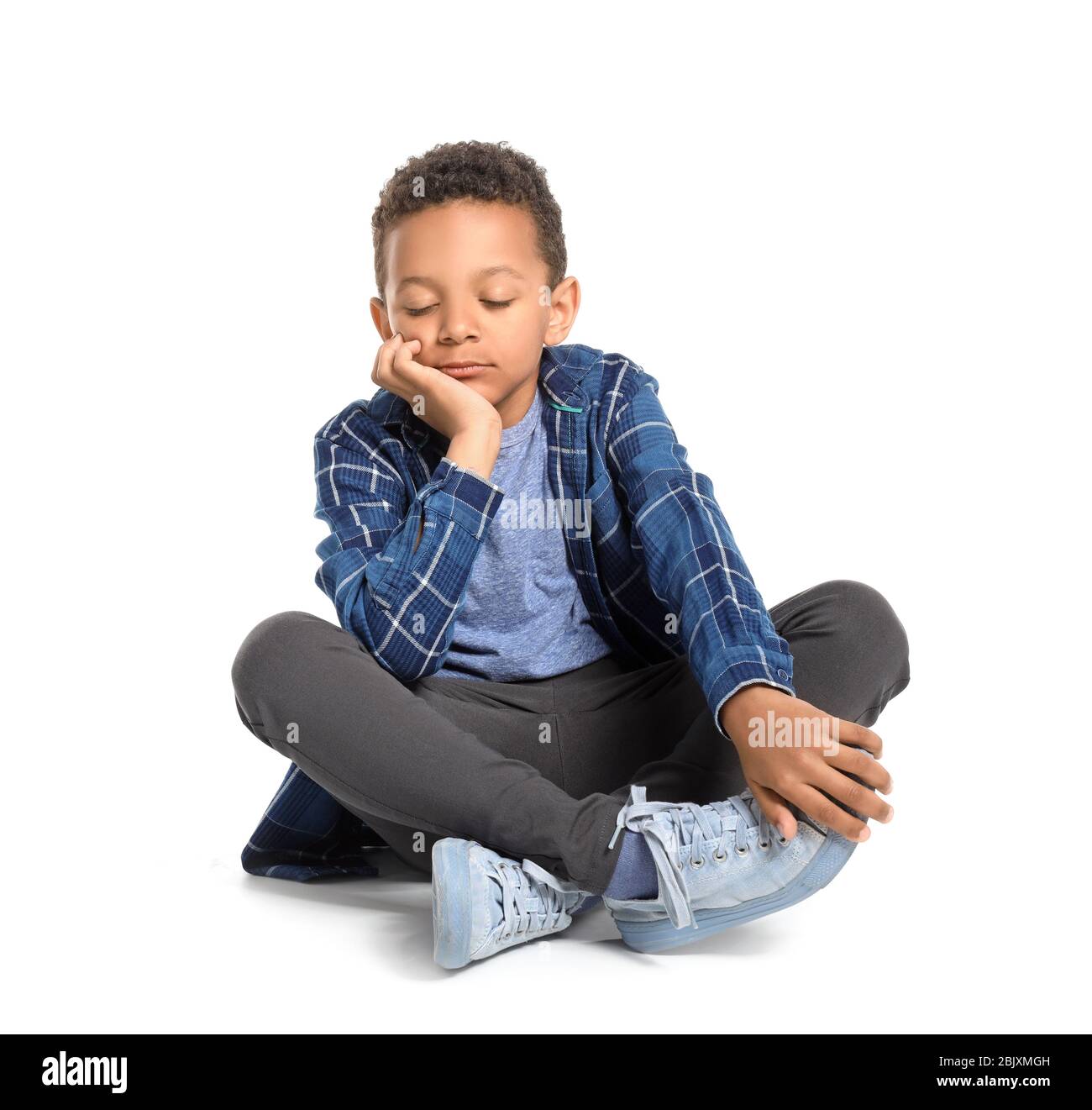 Sleepy African-American boy on white background Stock Photo - Alamy