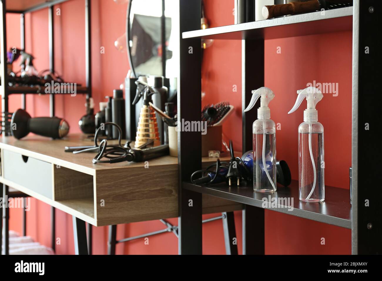 Hairdresser tools on shelves and table in beauty salon Stock Photo - Alamy