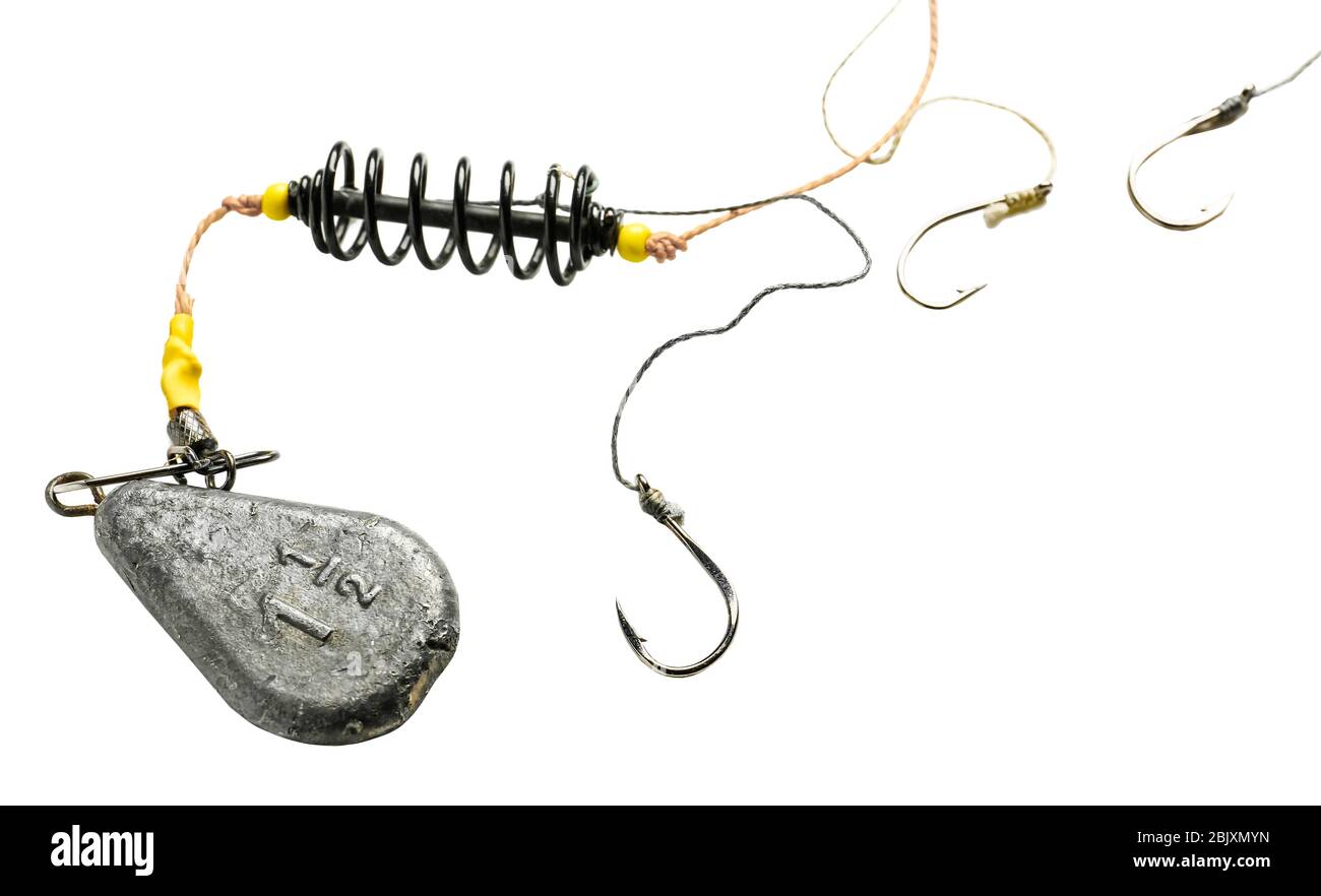 Fishing sinker and hooks on white background Stock Photo - Alamy